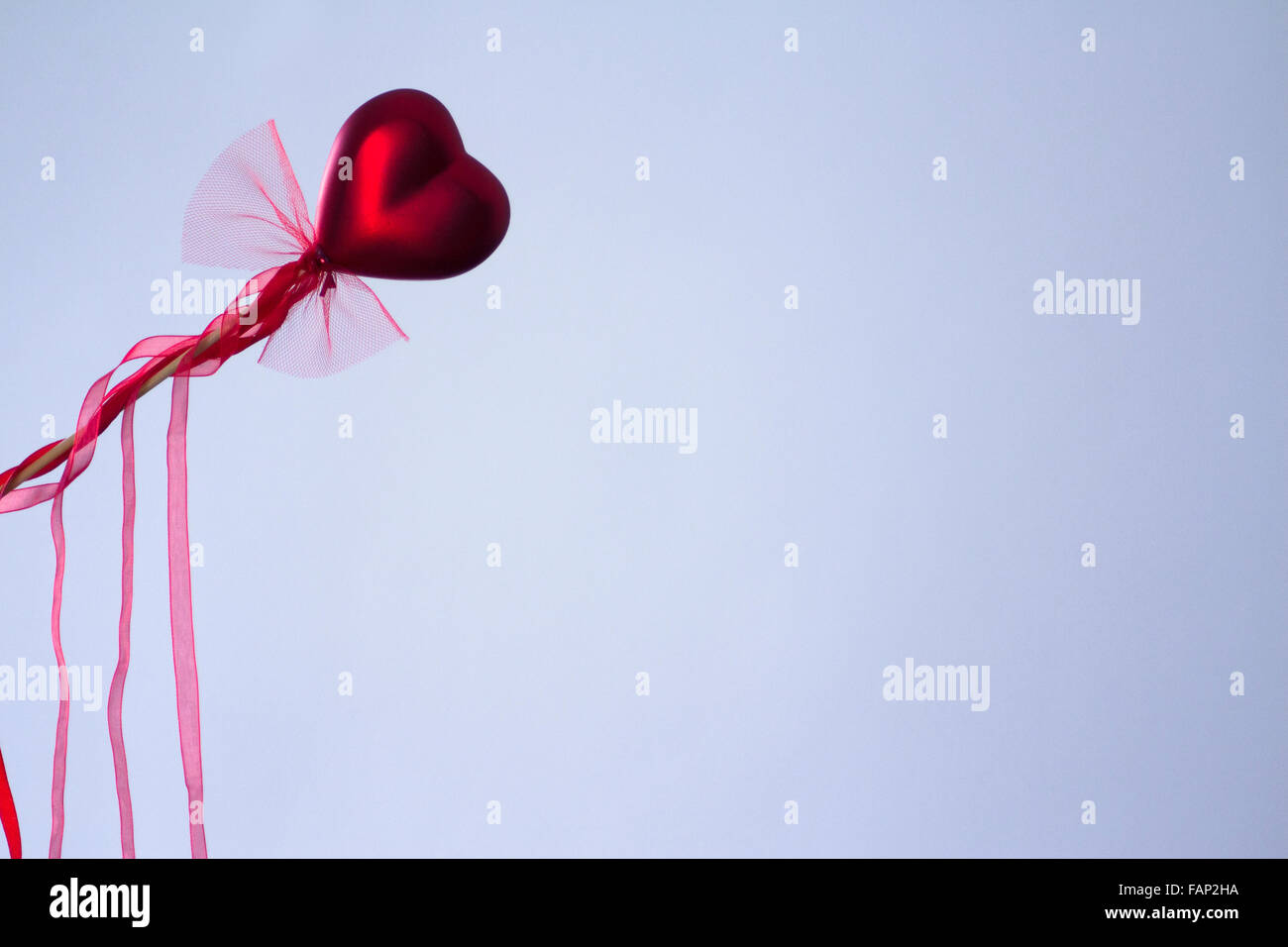 Red heart shape with hanging loops Stock Photo - Alamy