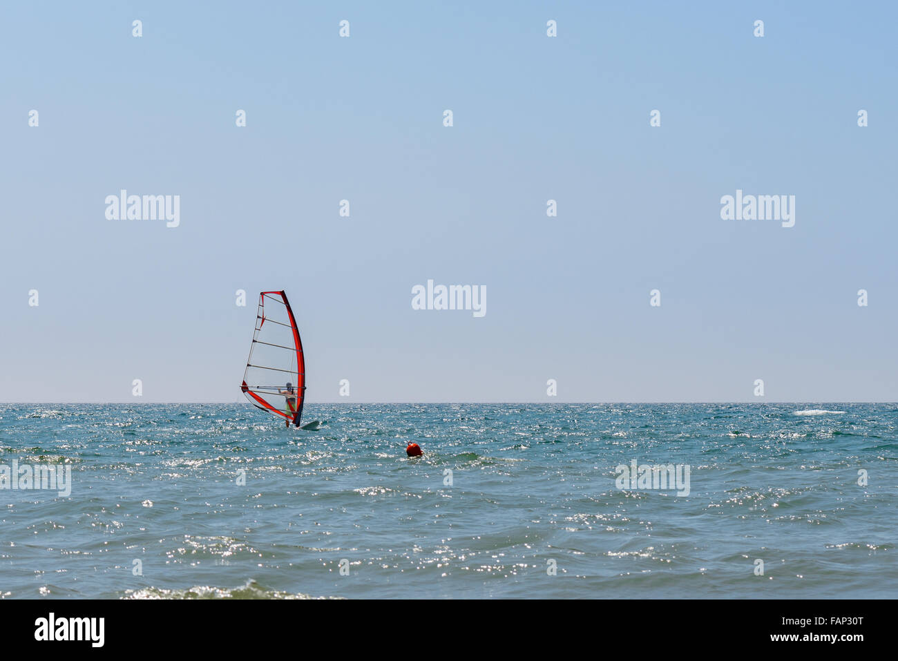 A windsurf sail on the sea in a windy day Stock Photo - Alamy