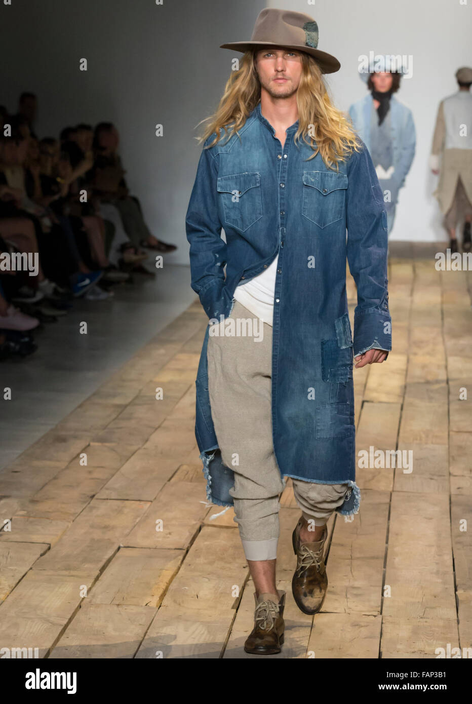 NEW YORK, NY - JULY 15, 2015: Odin Grina walks the runway during the ...
