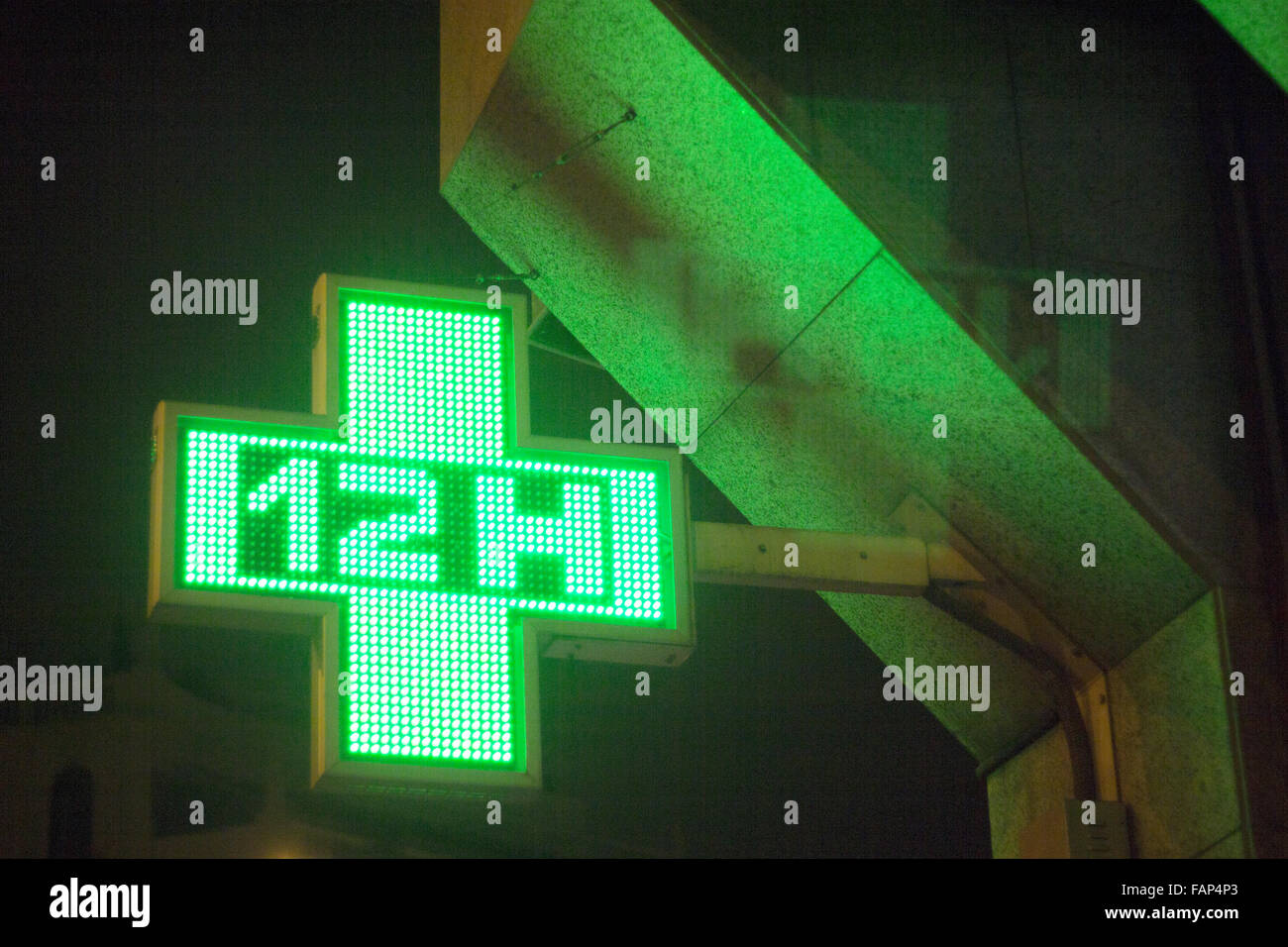 Pharmacy neon light chemists 12 hour open cross sign at night photo ...