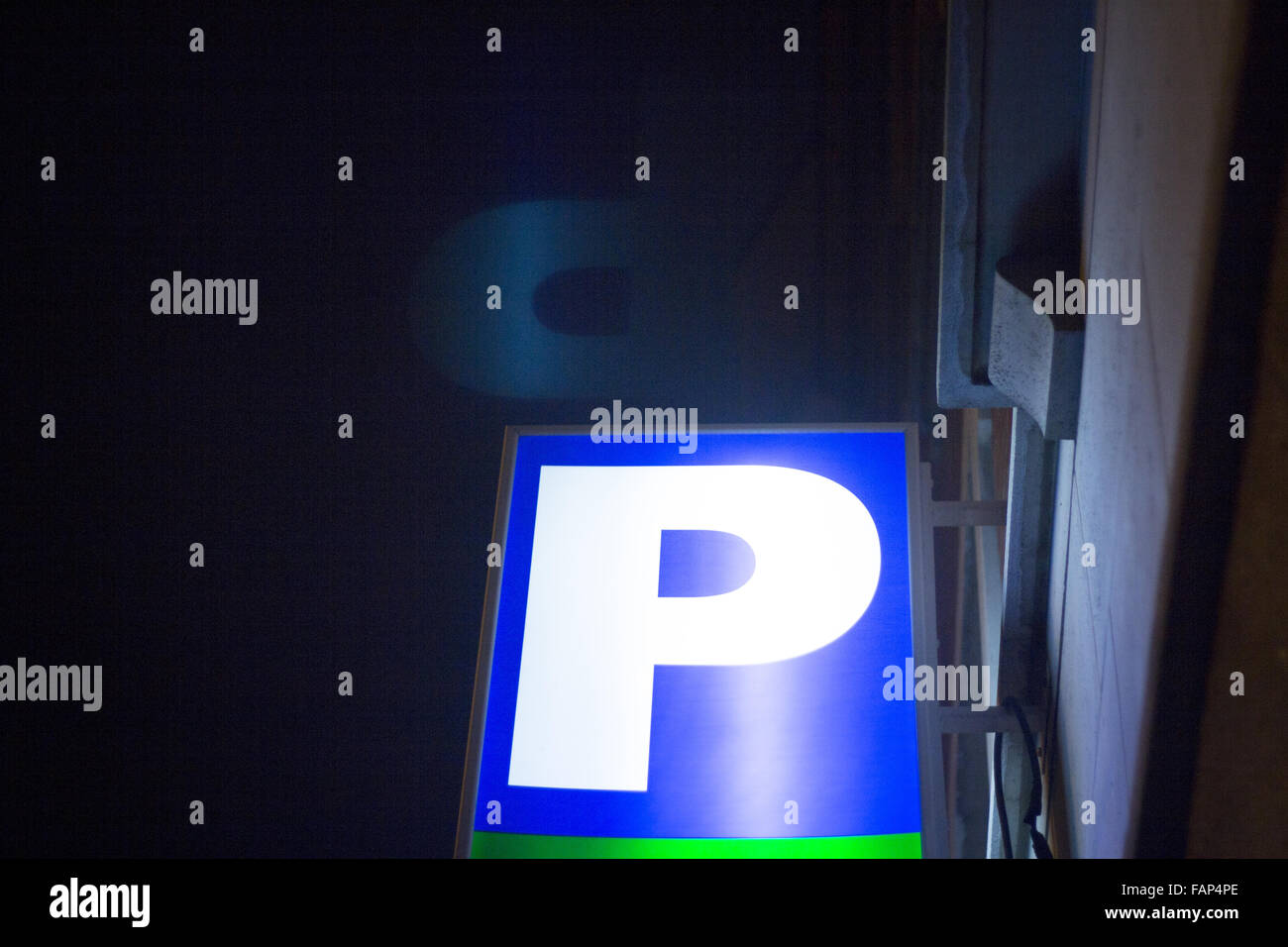 Car park light sign at night photo Stock Photo - Alamy