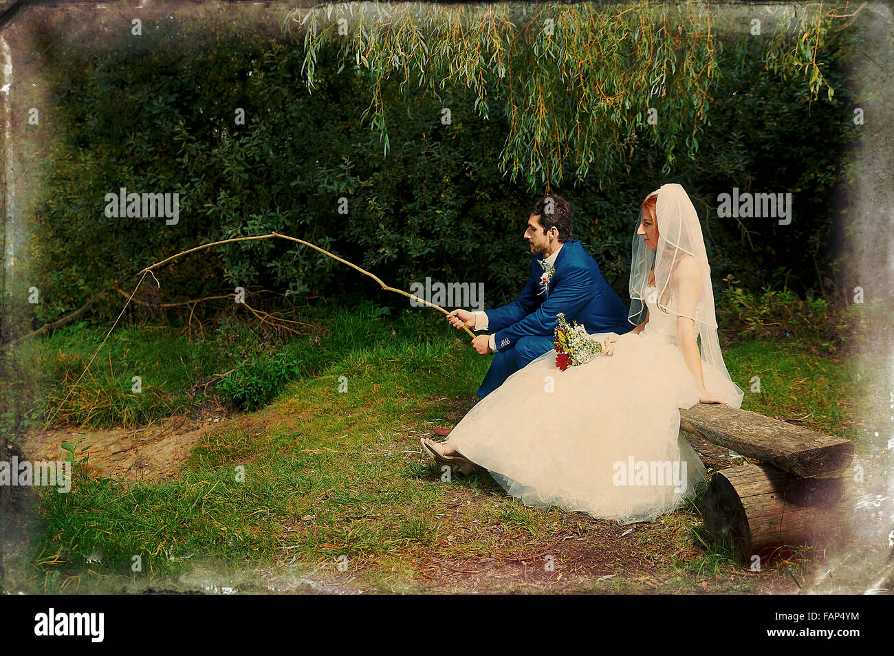 bride and groom fishing together - romantic wedding concept. Retro ...