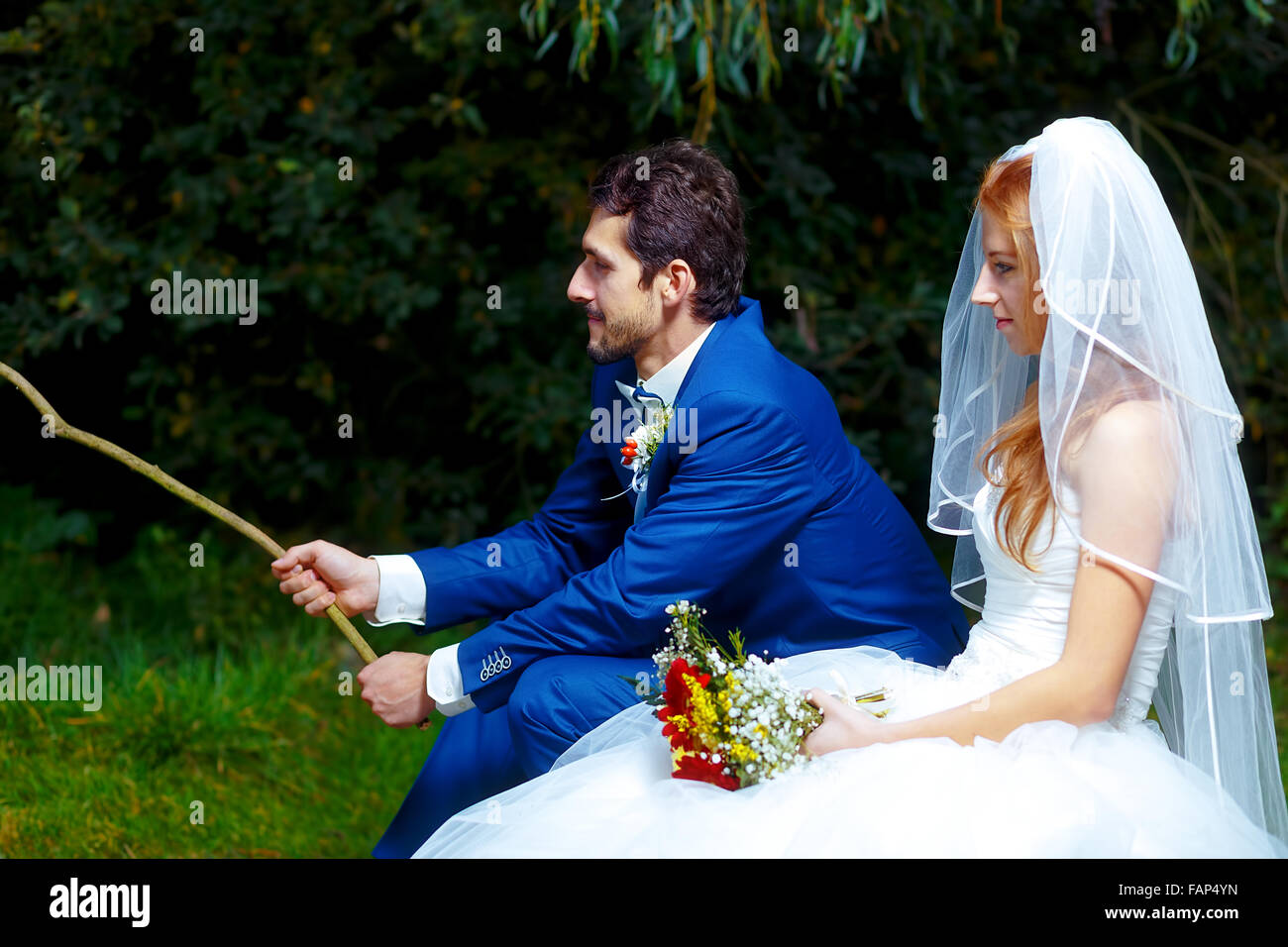bride and groom fishing together - romantic wedding concept Stock Photo ...