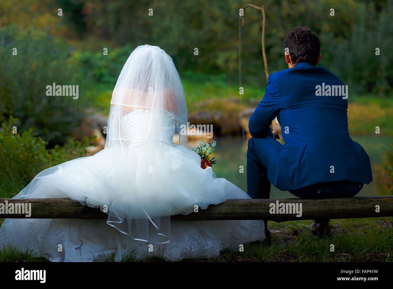 bride and groom fishing together - romantic wedding concept Stock Photo ...