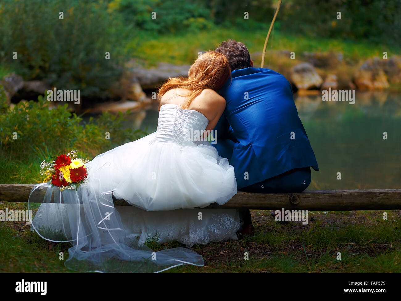 bride and groom fishing together - romantic wedding concept Stock Photo ...