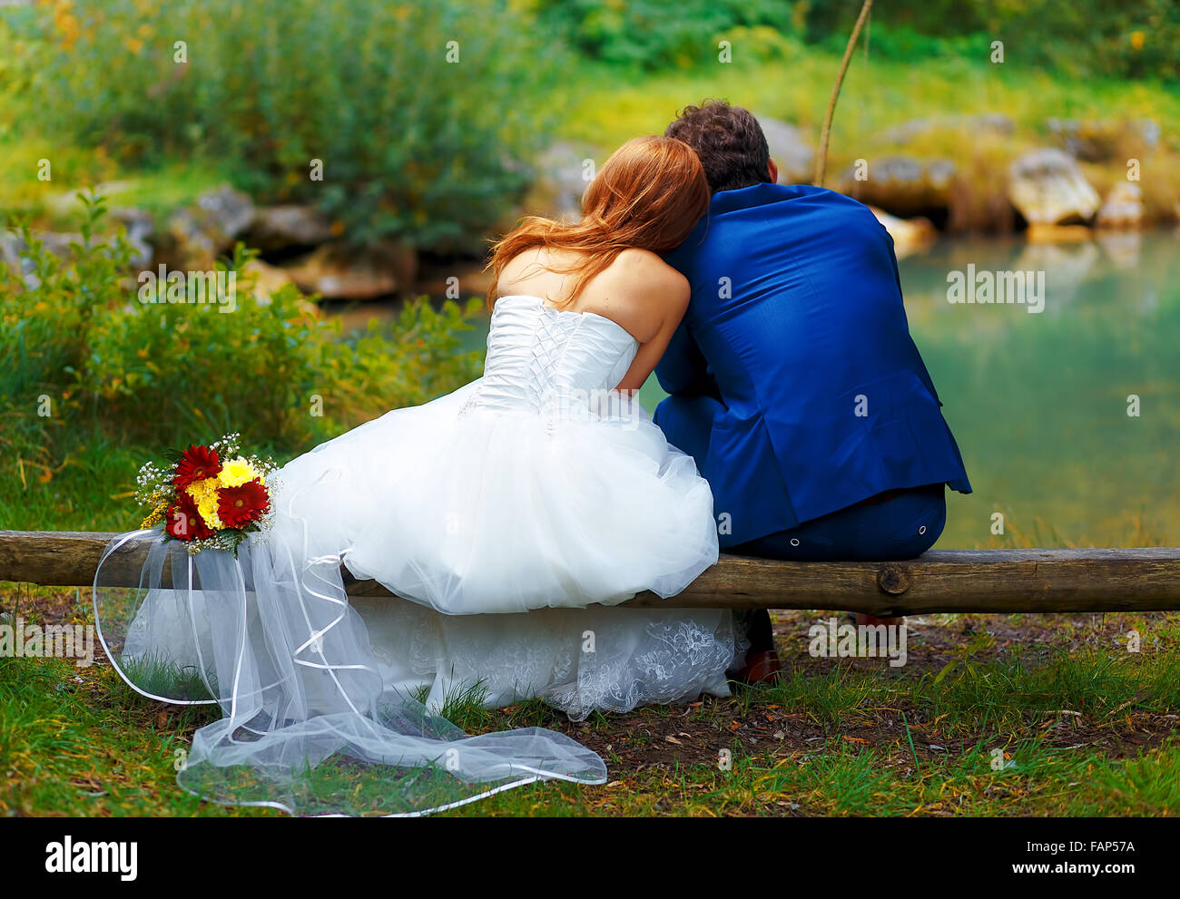 bride and groom fishing together - romantic wedding concept Stock Photo ...