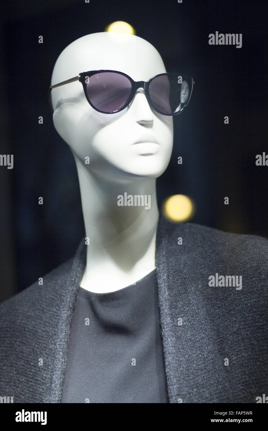 Women's clothes fashion store mannequin wearing black sunglasses and ...