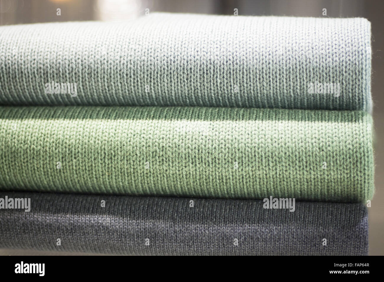 Clothes store winter sweater clothing in window photo Stock Photo - Alamy