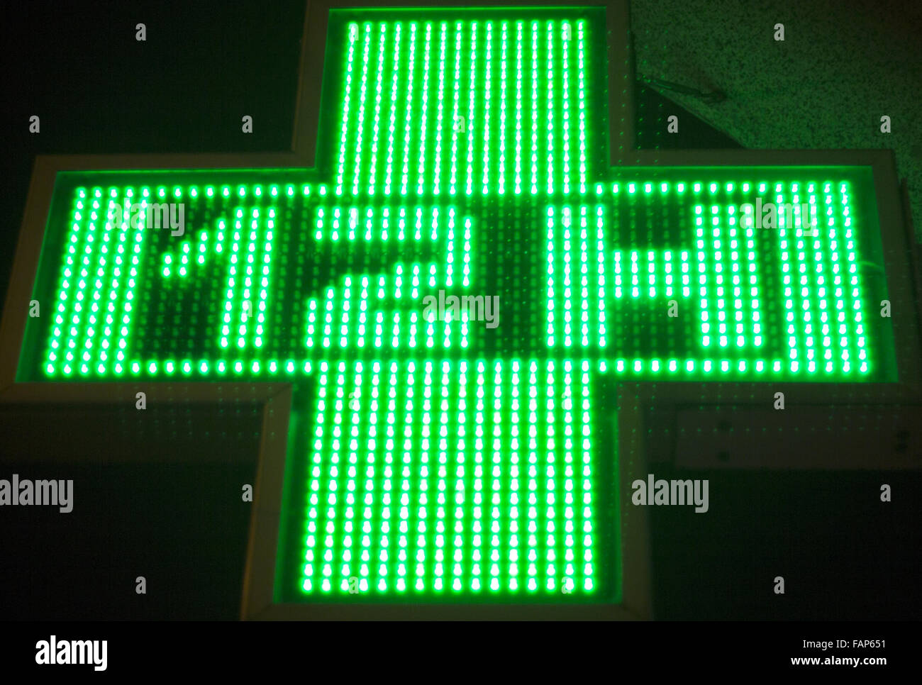 Pharmacy neon light chemists 12 hour open cross sign at night photo ...