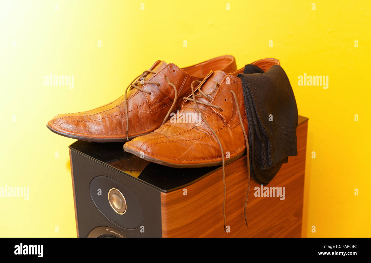 groom brown wedding shoes on speaker. Yellow background Stock Photo - Alamy