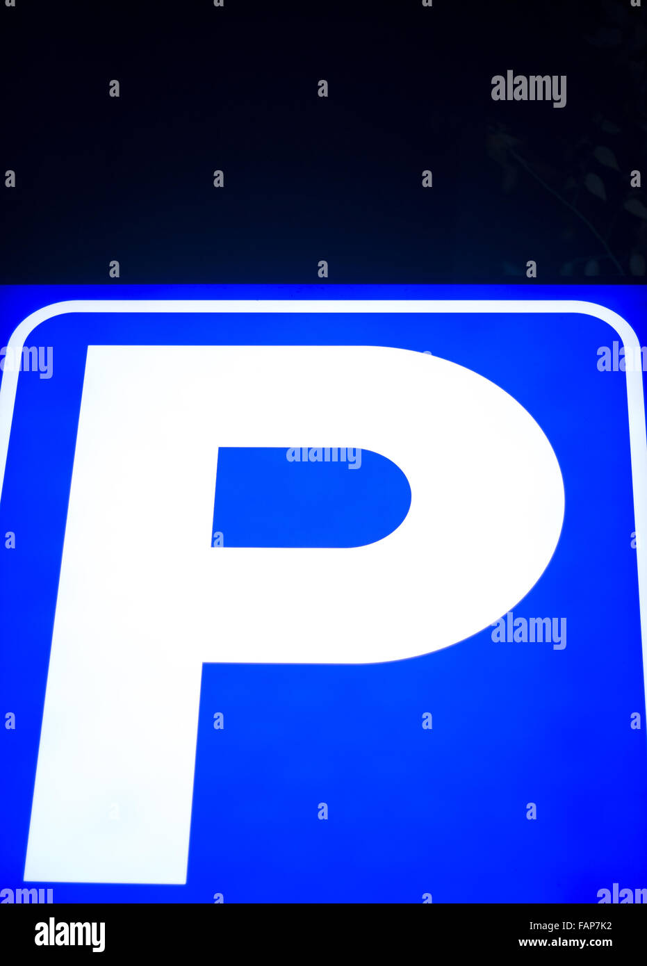 Car park light sign at night photo Stock Photo - Alamy