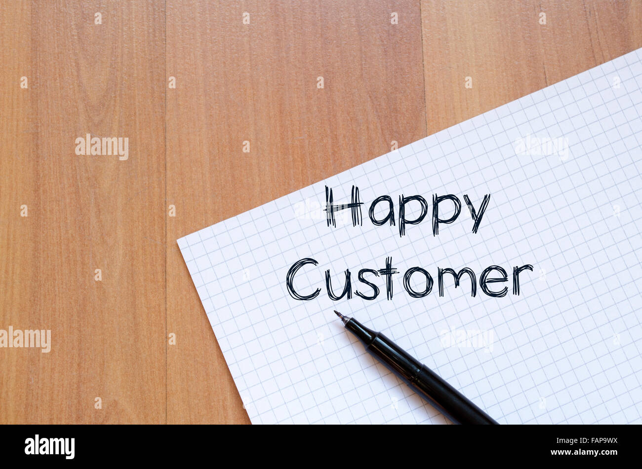 Happy customer text concept write on notebook with pen Stock Photo - Alamy