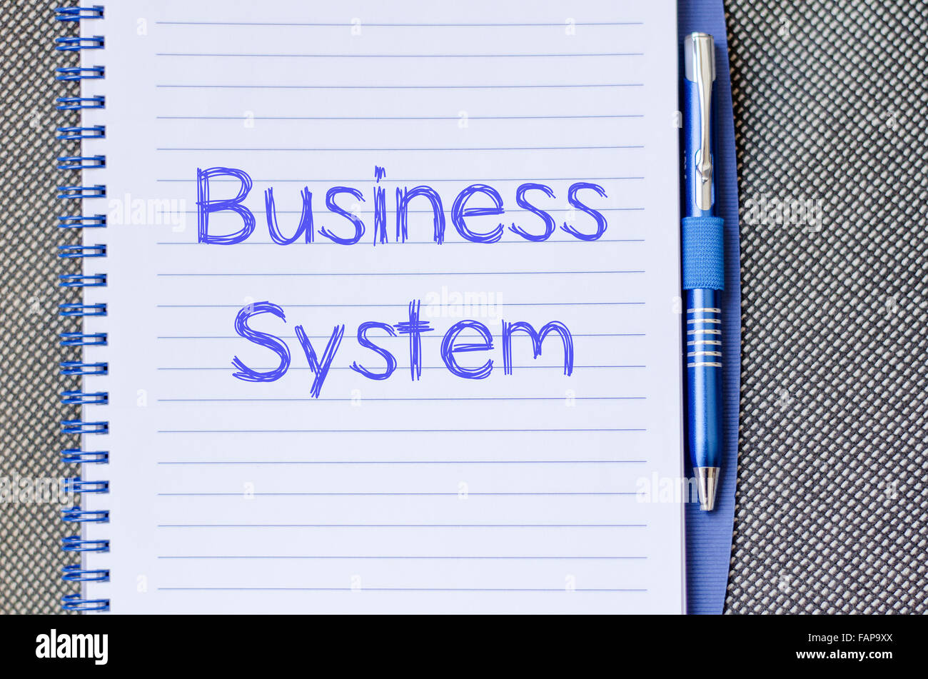 Business system text concept write on notebook with pen Stock Photo - Alamy