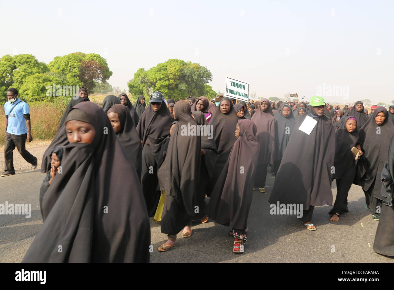 Shia Muslims march on the highway to commemorate the 40th anniversary ...