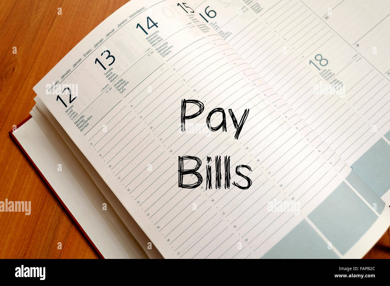 Pay bills text concept write on notebook Stock Photo - Alamy