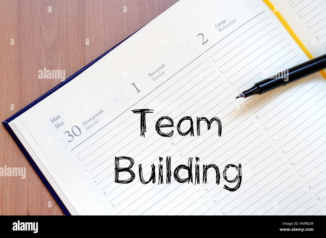 Team building text concept write on notebook with pen Stock Photo - Alamy