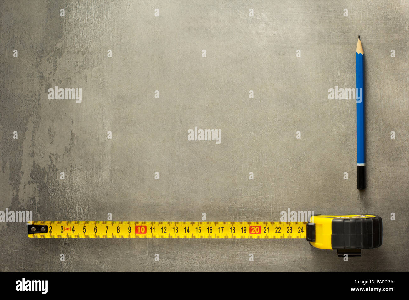 tape measure and pencil on old texture Stock Photo - Alamy