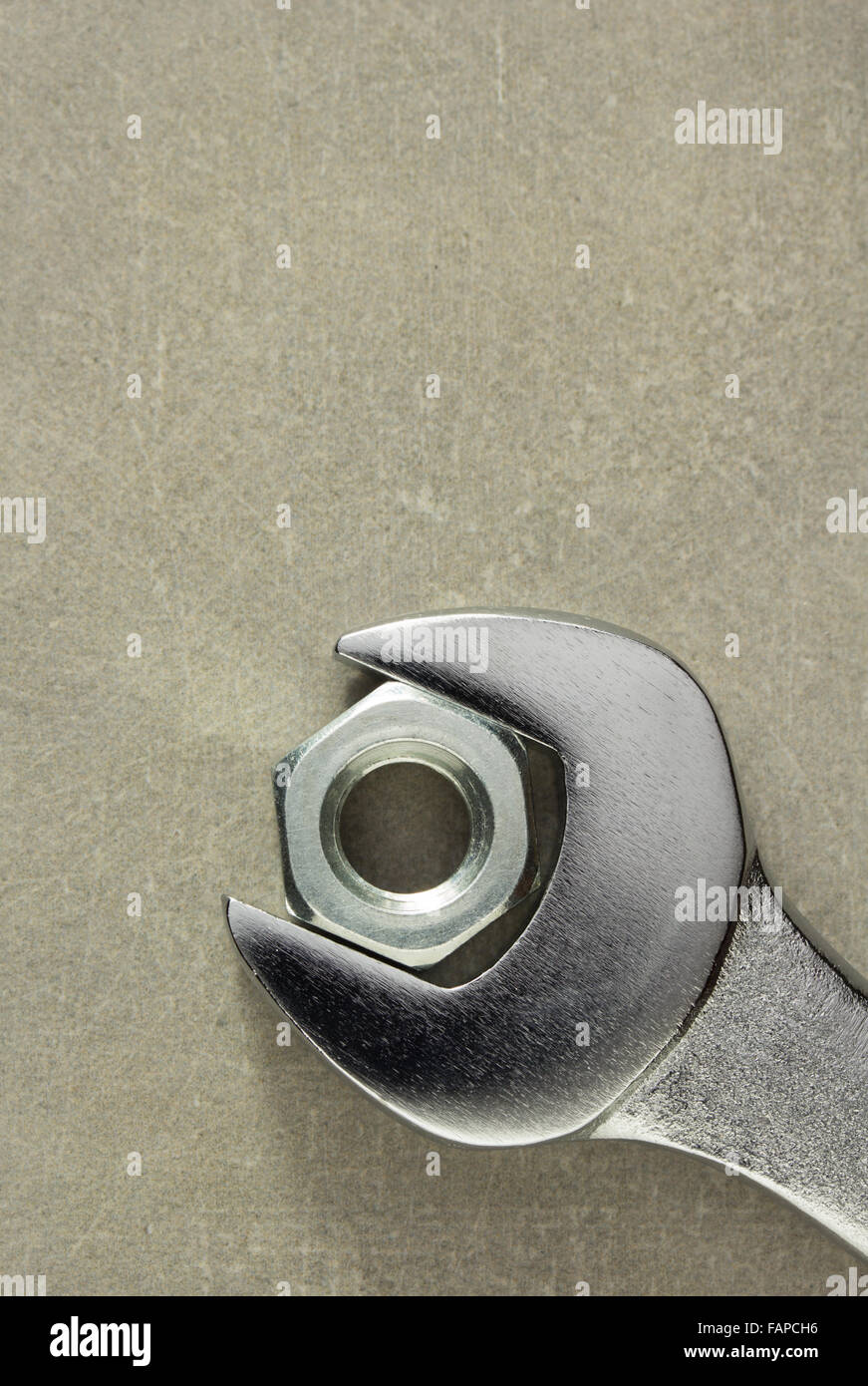 wrench tools and nut at metal background Stock Photo - Alamy