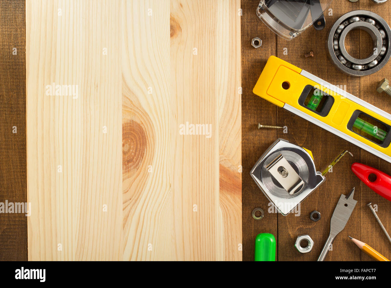 work tools and instruments on wooden background Stock Photo - Alamy