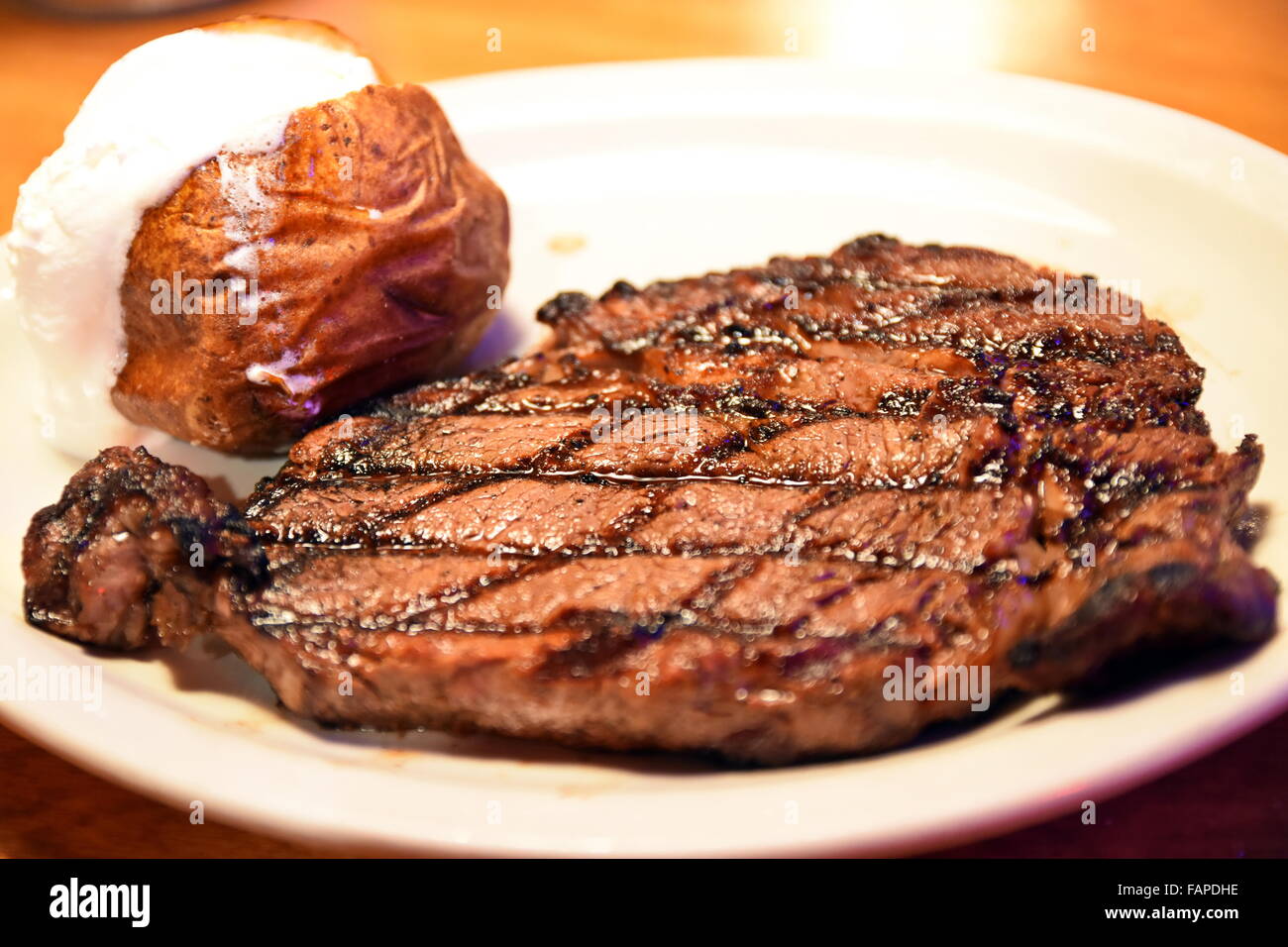 Rib eye steak with ribs and mash potato at the restaurant Stock Photo ...