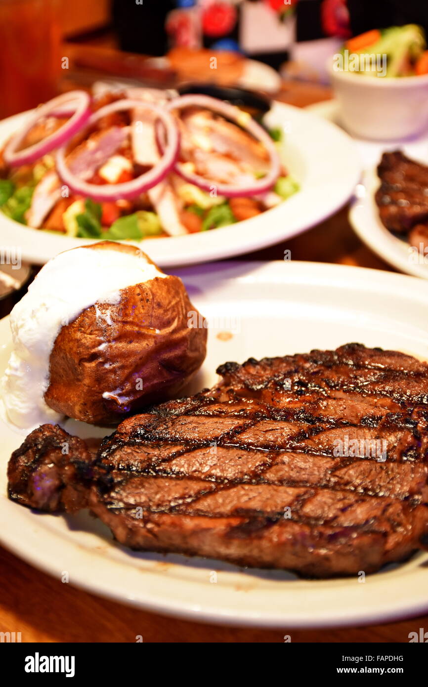 Rib eye steak with ribs and mash potato at the restaurant Stock Photo ...