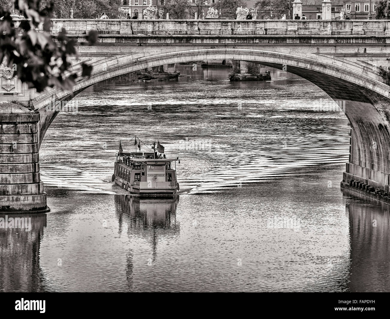 Tour boat under Ponte Umberto bridge in Rome, Italy Stock Photo - Alamy