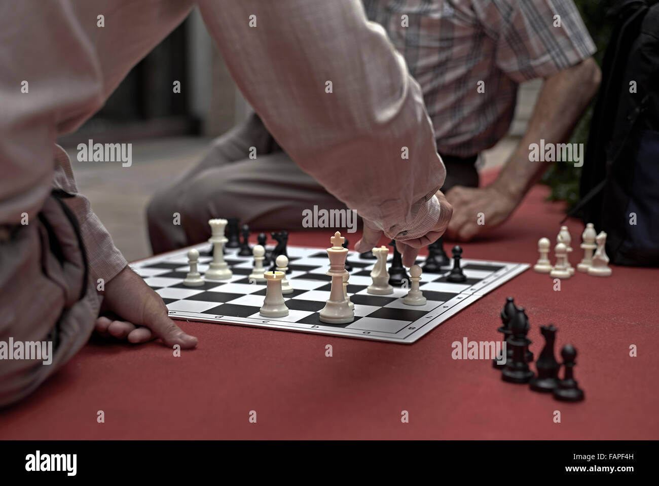 Chess game with players Stock Photo - Alamy
