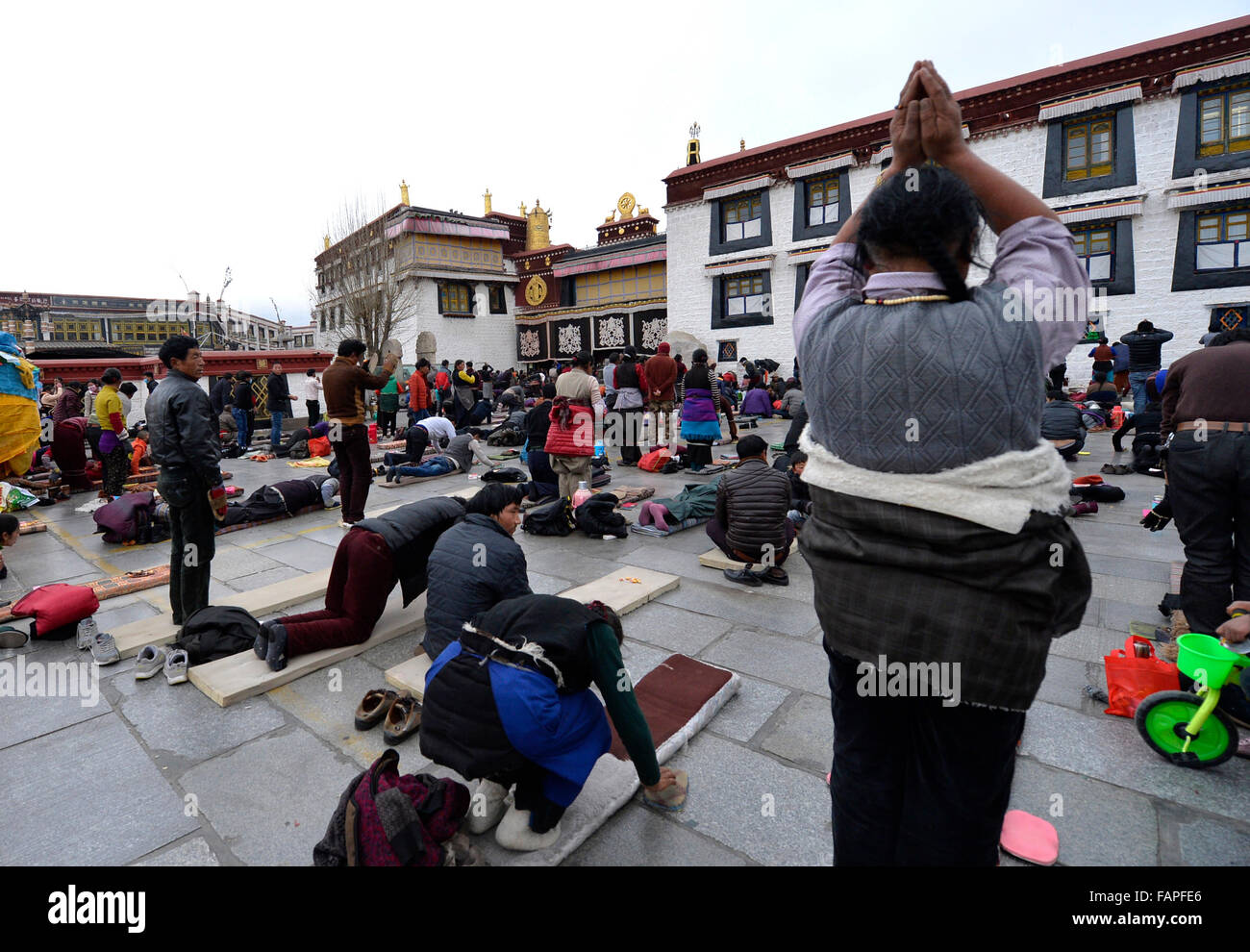 Lhasa, China's Tibet Autonomous Region. 3rd Jan, 2016. Pilgrims pray at ...