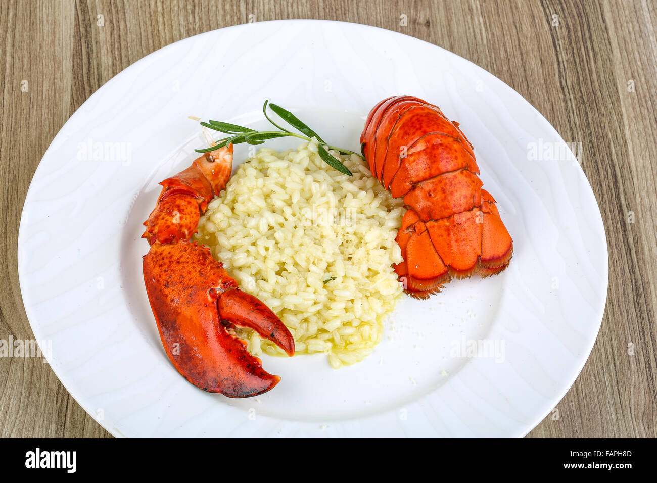 Delicous Risotto with lobster served rosemary and parmesan Stock Photo ...