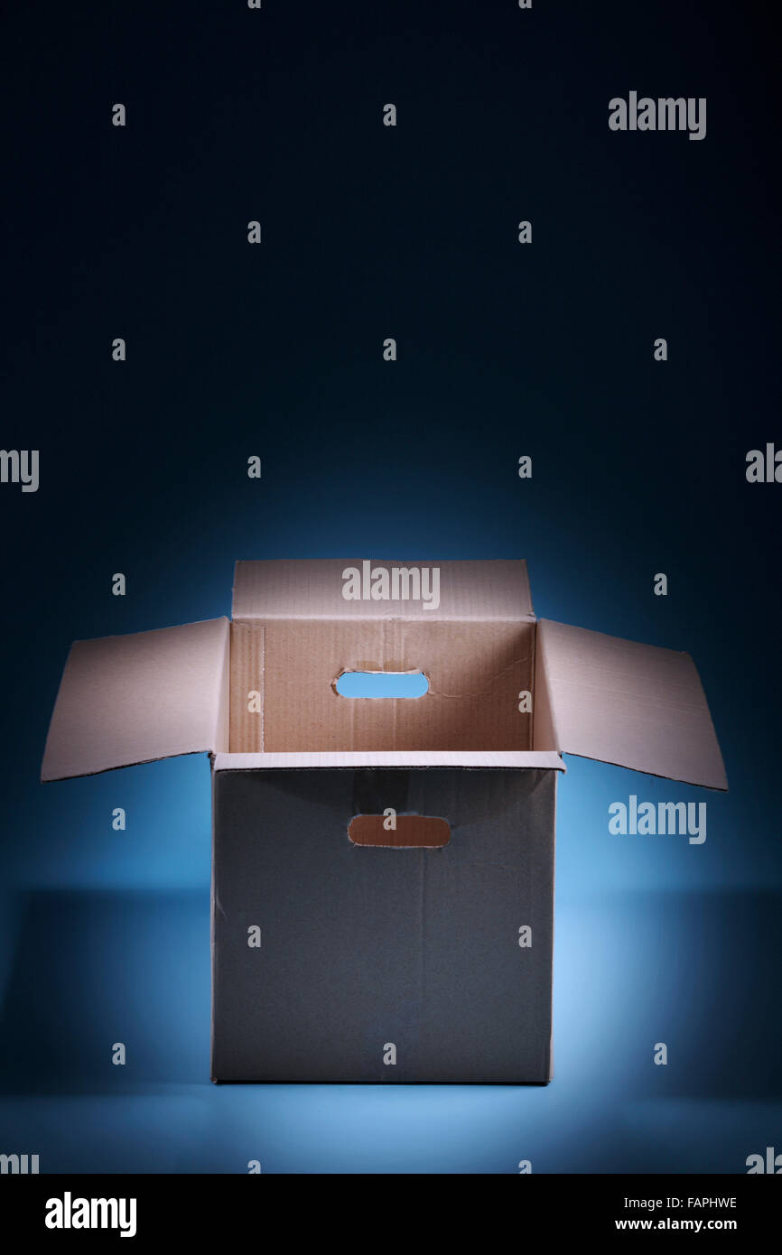 Empty Cardboard Box on the blue background Stock Photo - Alamy