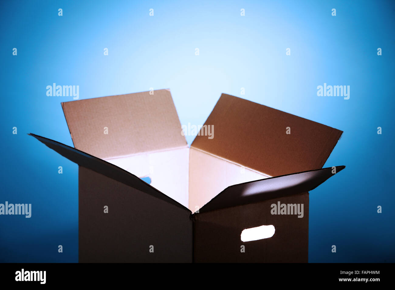 Glowing rays of light coming out of an open box Stock Photo - Alamy