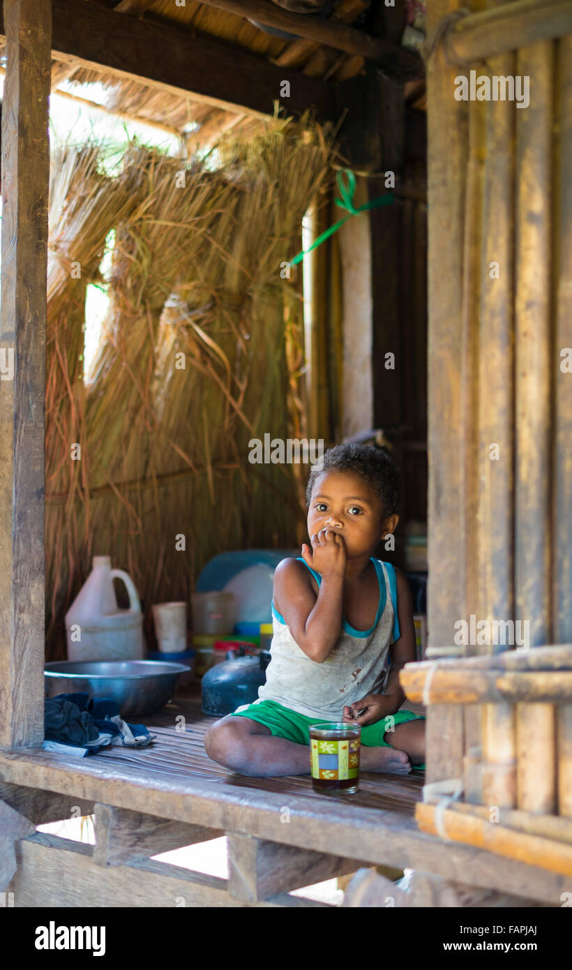 A baby girl sitting in a hut in rural philippines Stock Photo - Alamy