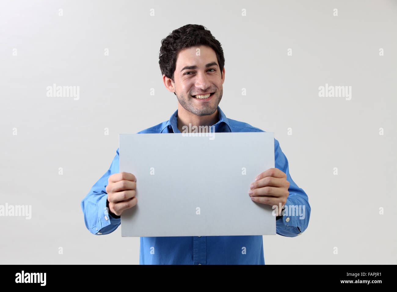 Man holding blank paper Stock Photo - Alamy