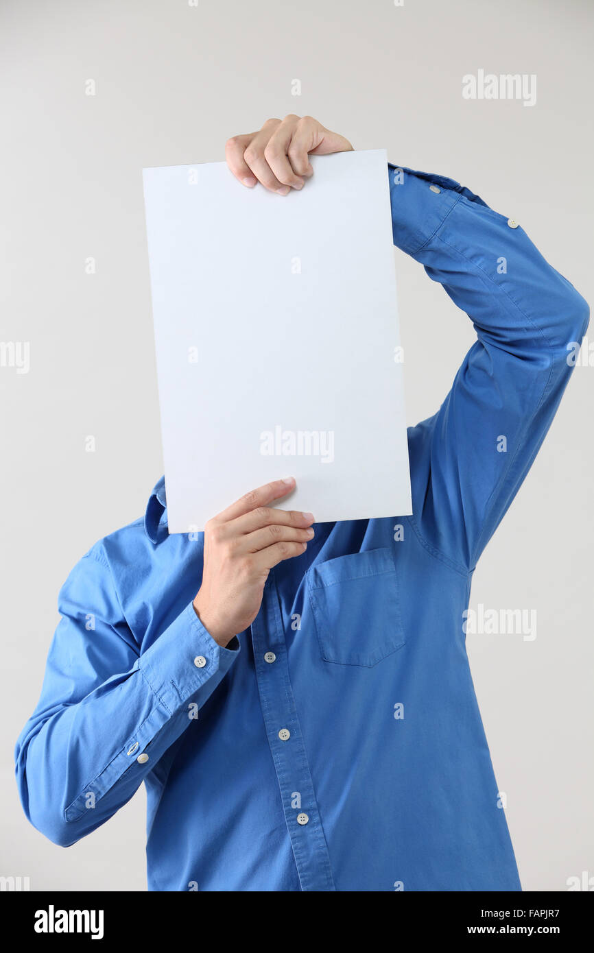 Man holding blank paper cover the face Stock Photo - Alamy
