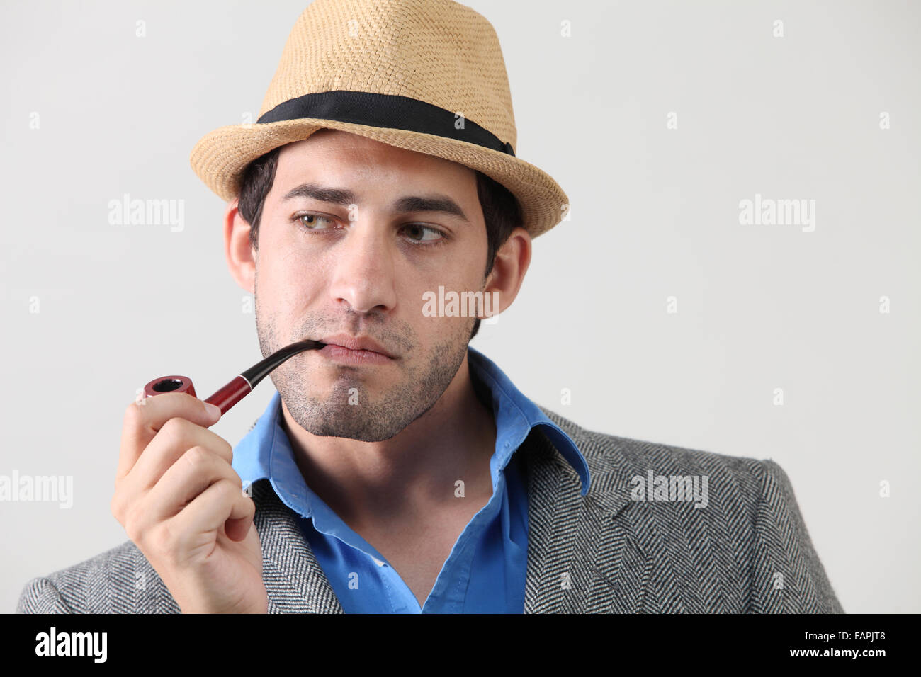 Man with pipe in mouth Stock Photo - Alamy