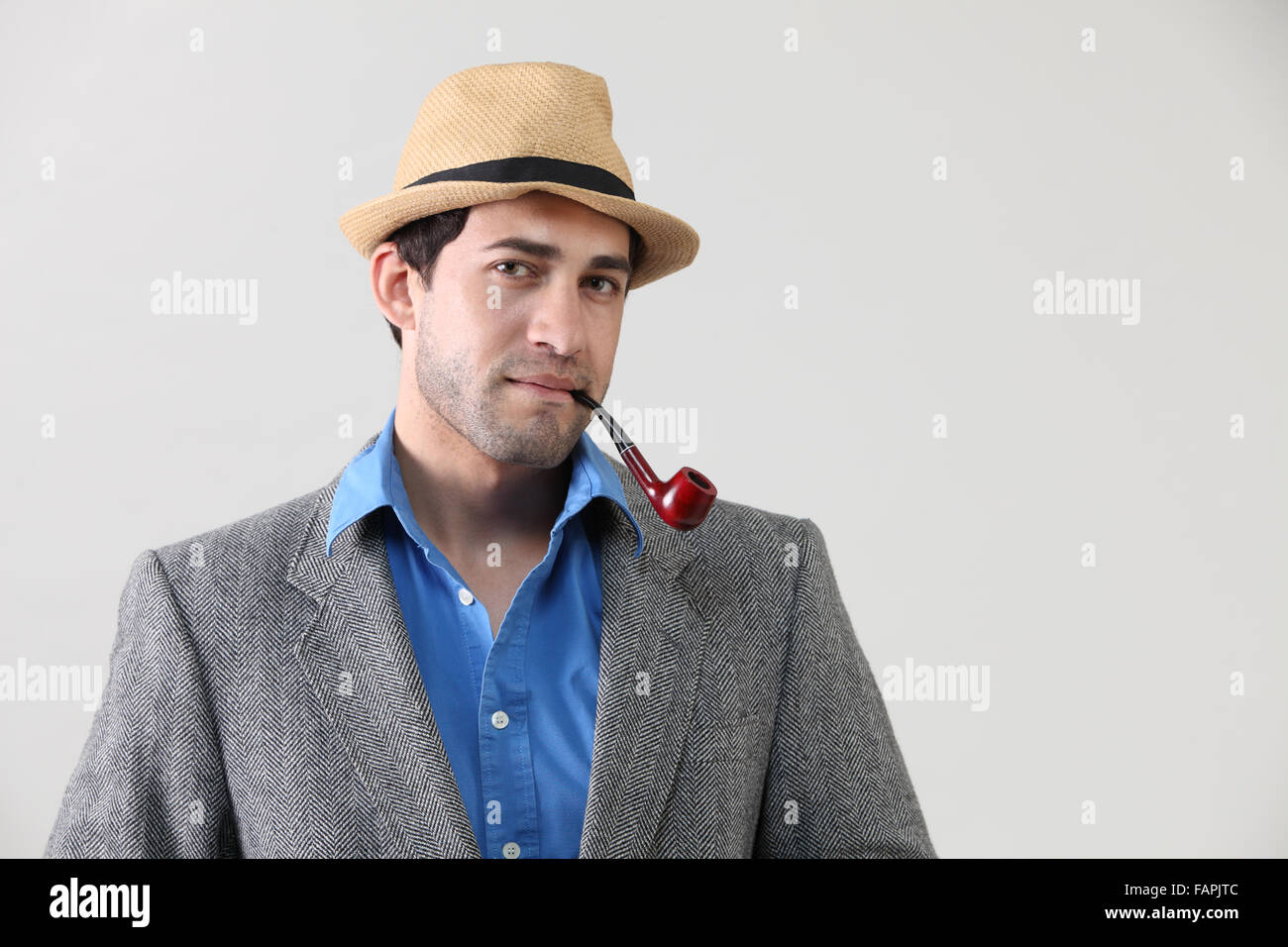 Man with pipe in mouth Stock Photo - Alamy