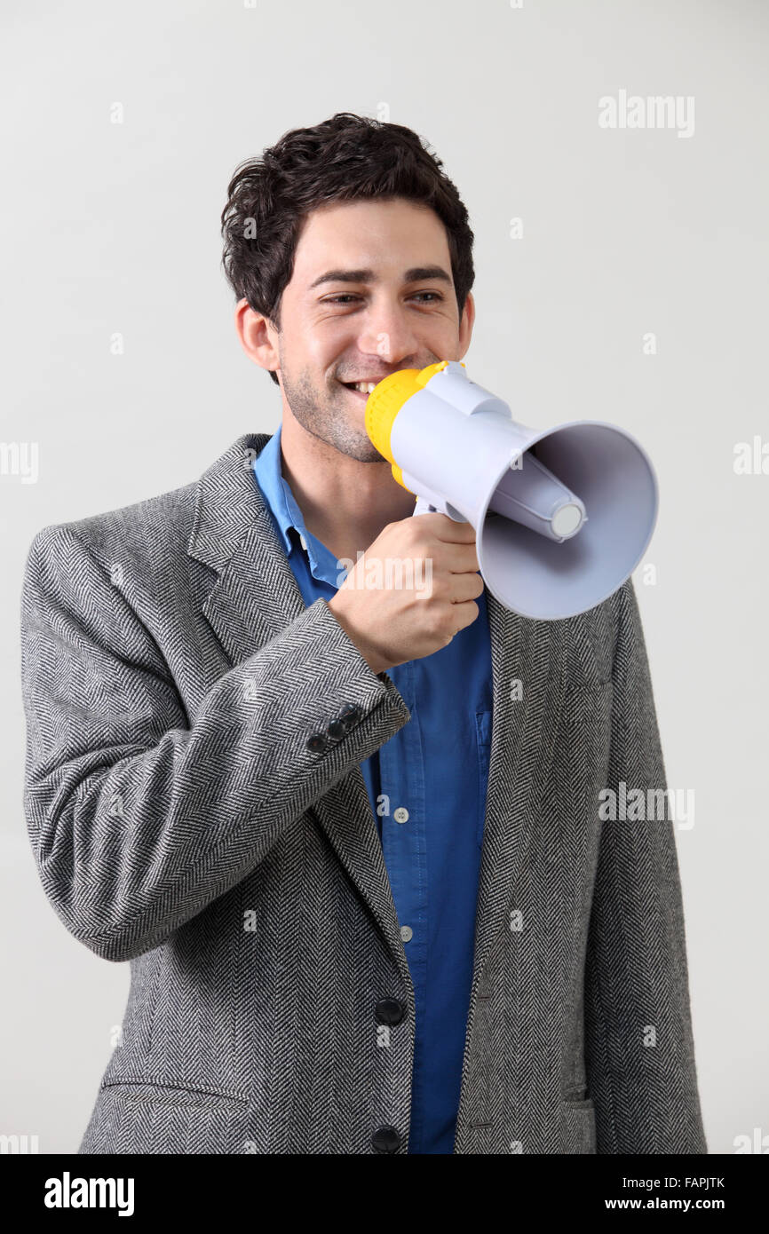 Businessman shouting through megaphone Stock Photo - Alamy