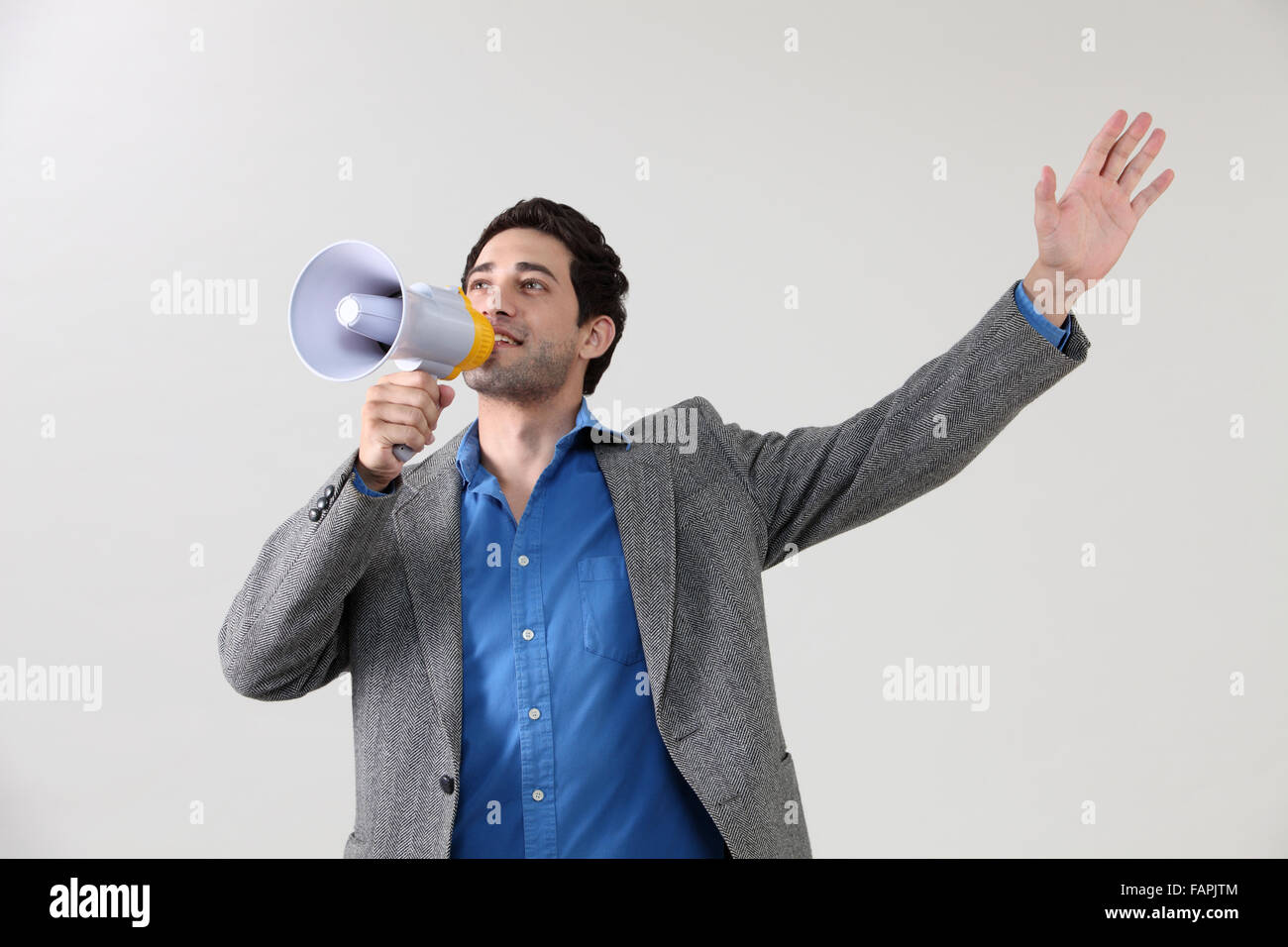 Businessman shouting through megaphone Stock Photo - Alamy