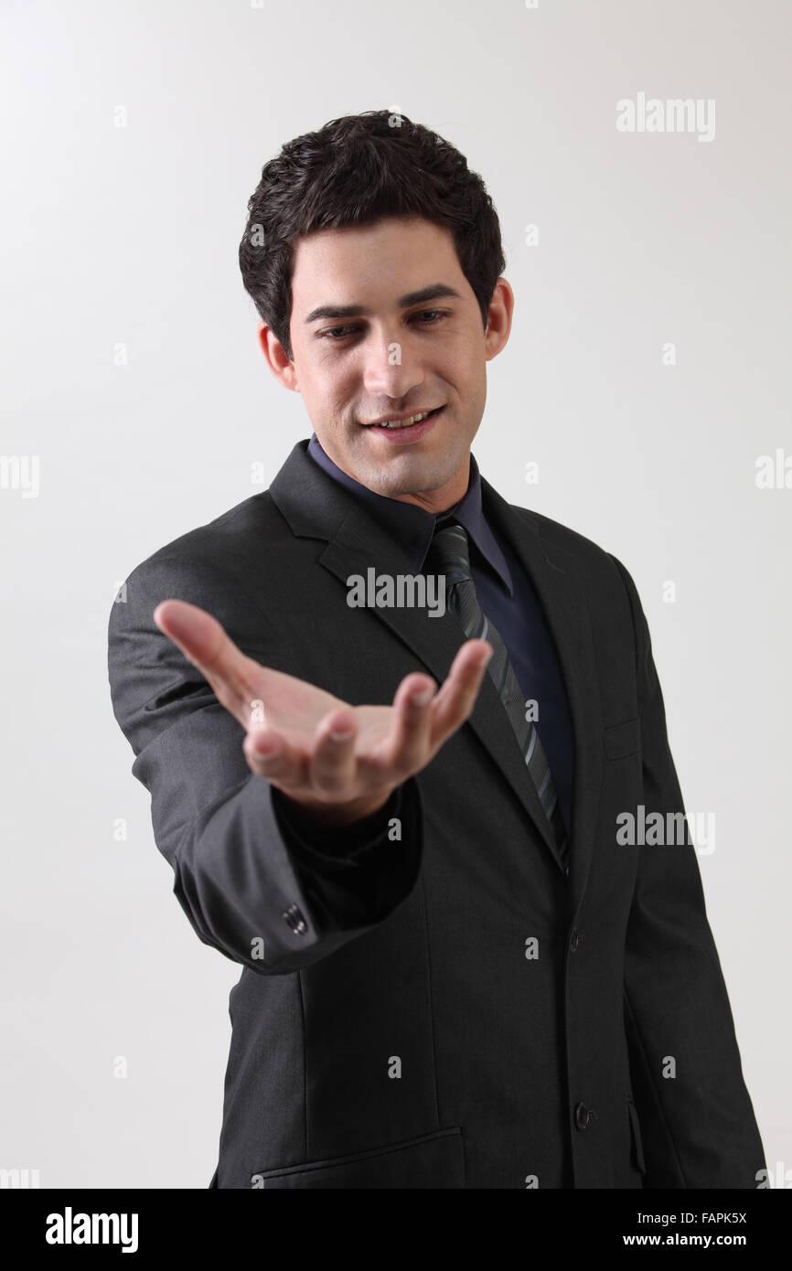 Businessman holding virtual sphere Stock Photo - Alamy Businessman holding virtual sphere Stock Photo - Alamy