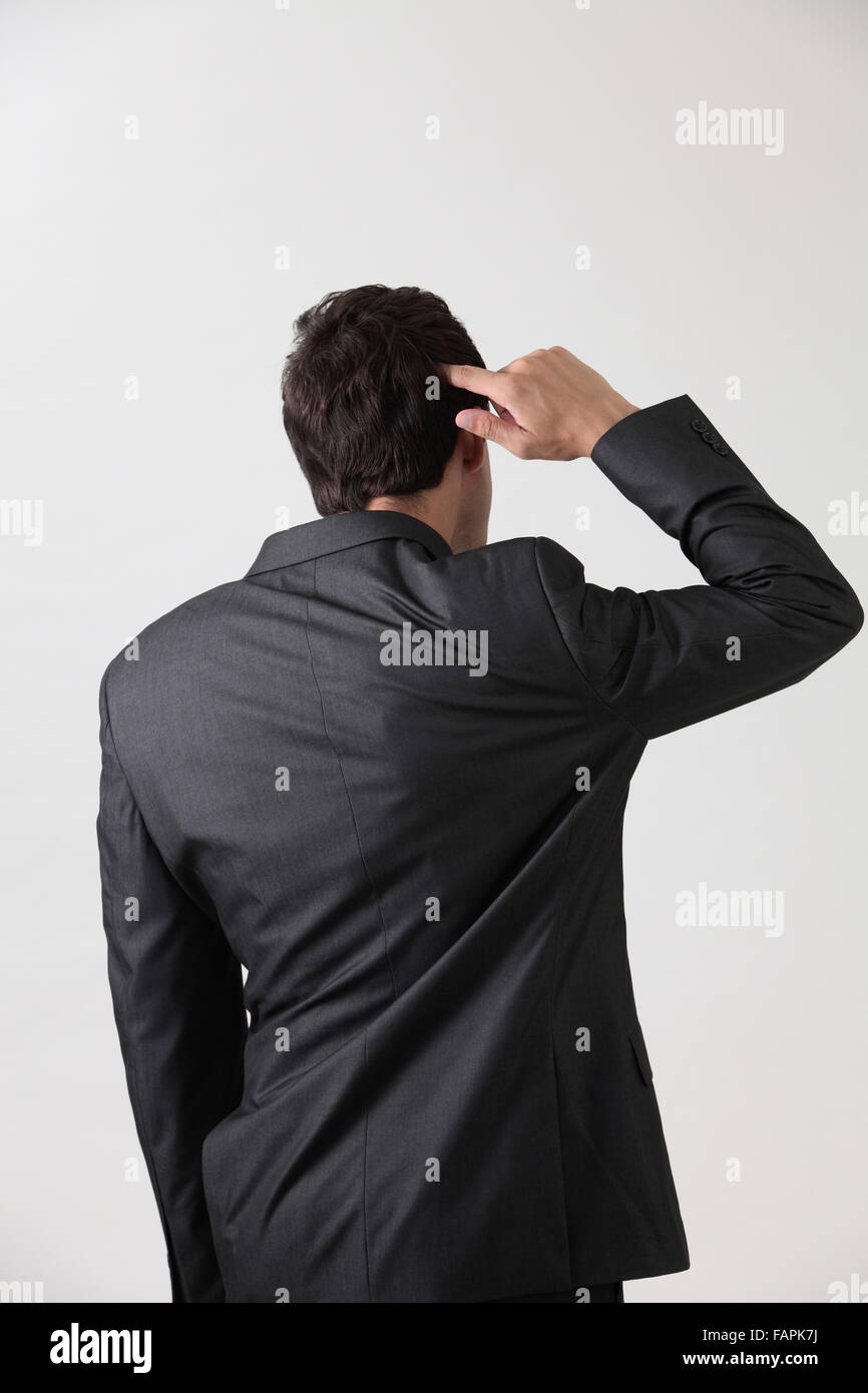 Back view of people scratching head hi-res stock photography and images ...