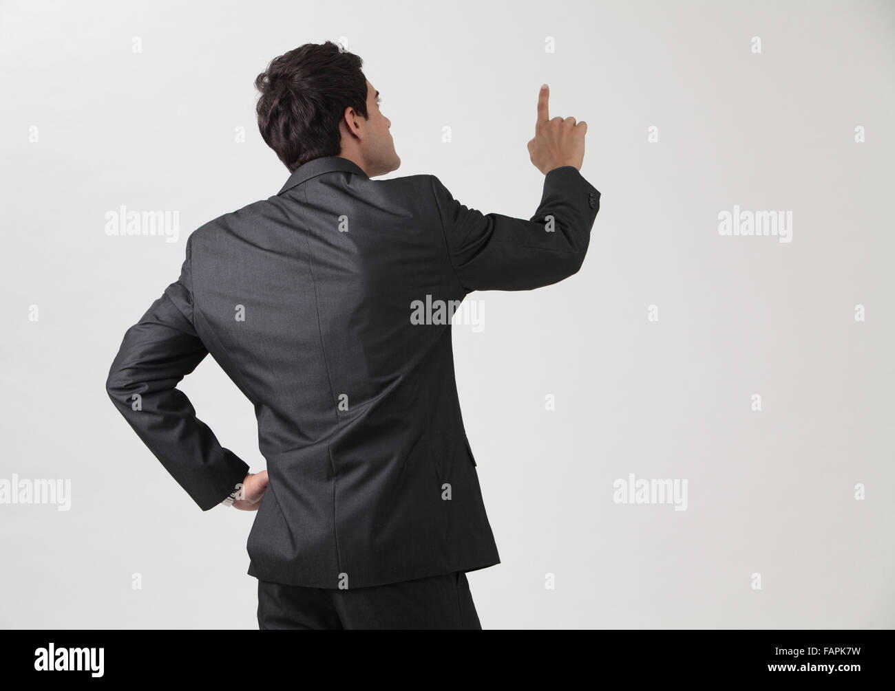 Back view pointing business man hi-res stock photography and images - Alamy