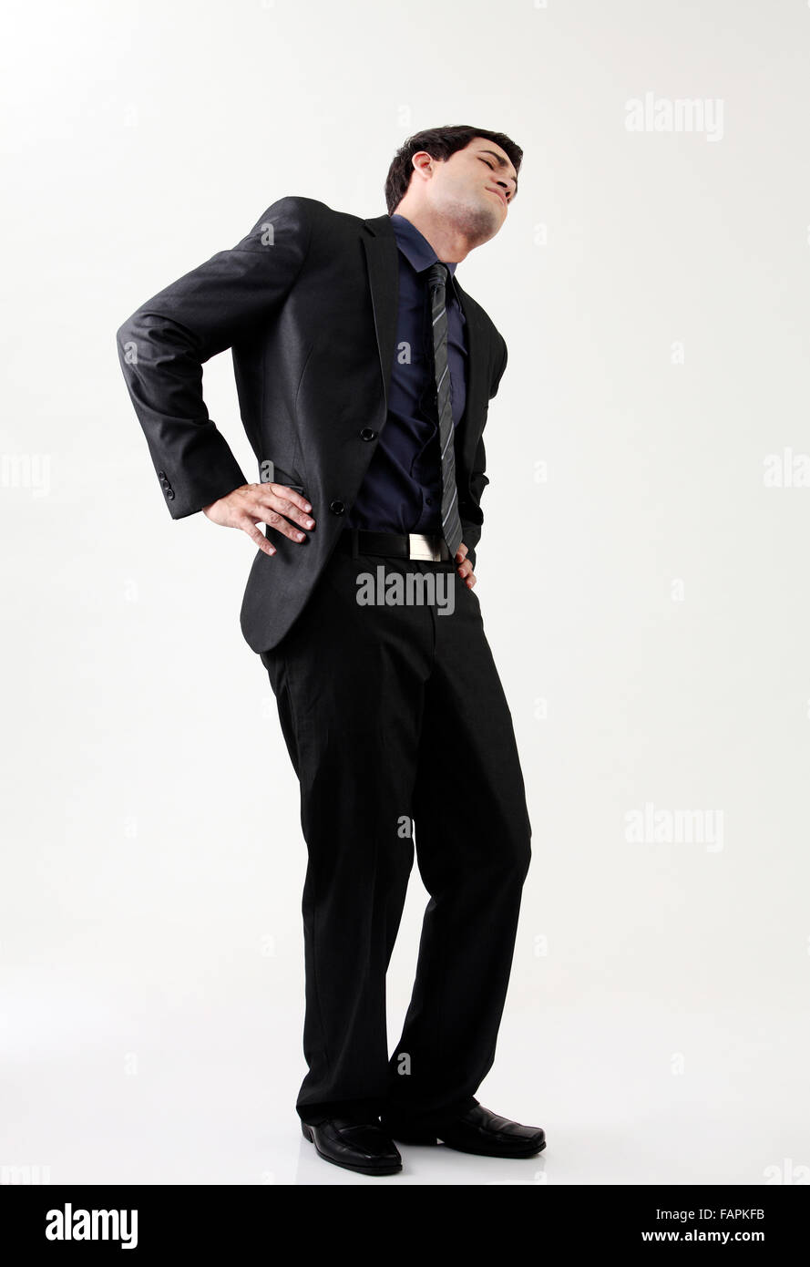 full length of Man Suffering Back Pain Stock Photo - Alamy