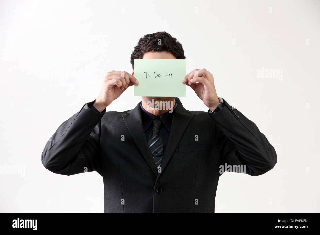 Businessman holding message card,covered his face Stock Photo - Alamy