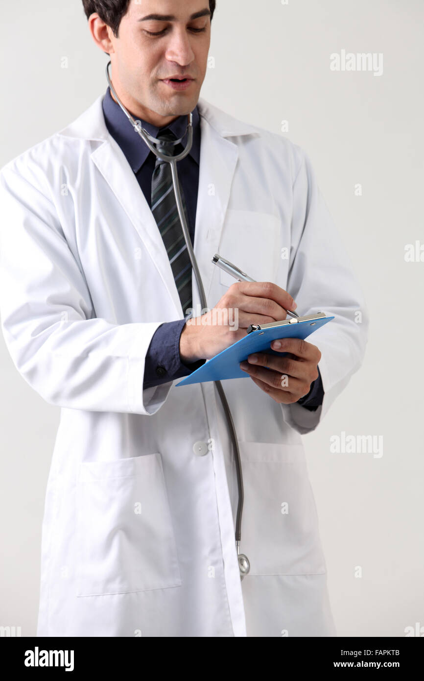 close up Confident doctor taking notes Stock Photo - Alamy