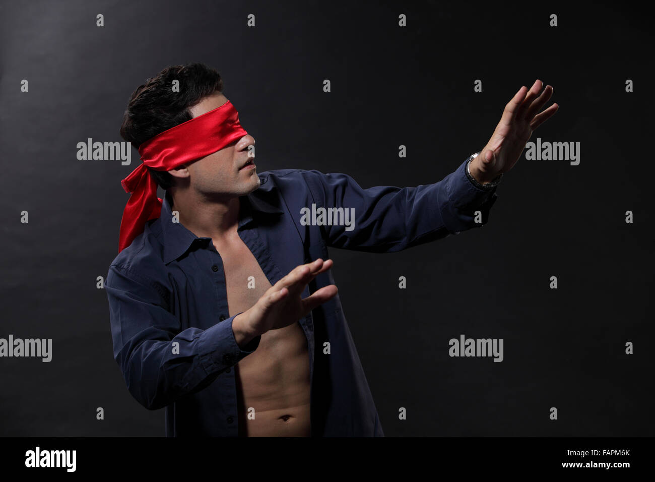 Men blindfolded hi-res stock photography and images - Alamy