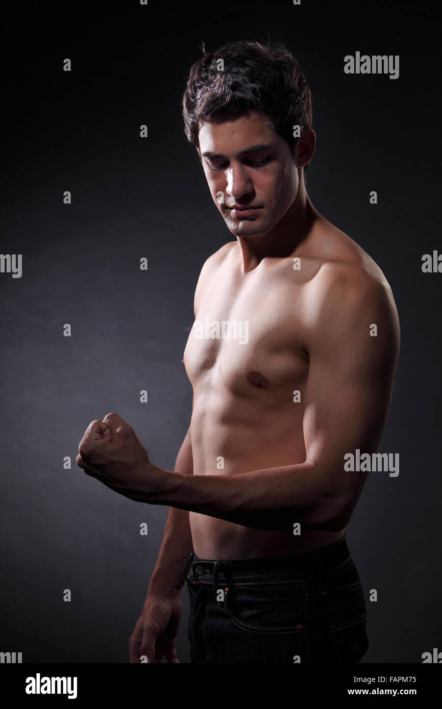 shirtless male model in jeans on the dark background Stock Photo - Alamy