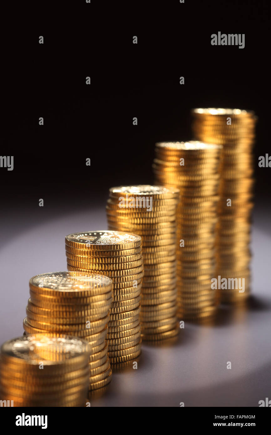 numbers stack of coin form a graph Stock Photo - Alamy