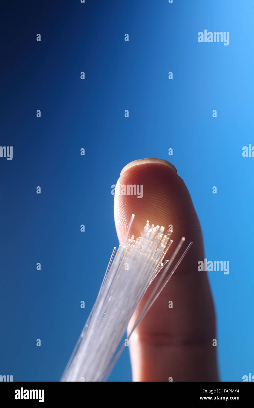 finger touching the fiber optic Stock Photo - Alamy
