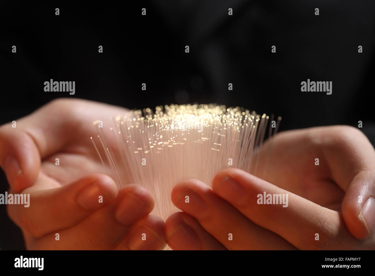 close up of hand and fiber optic Stock Photo - Alamy