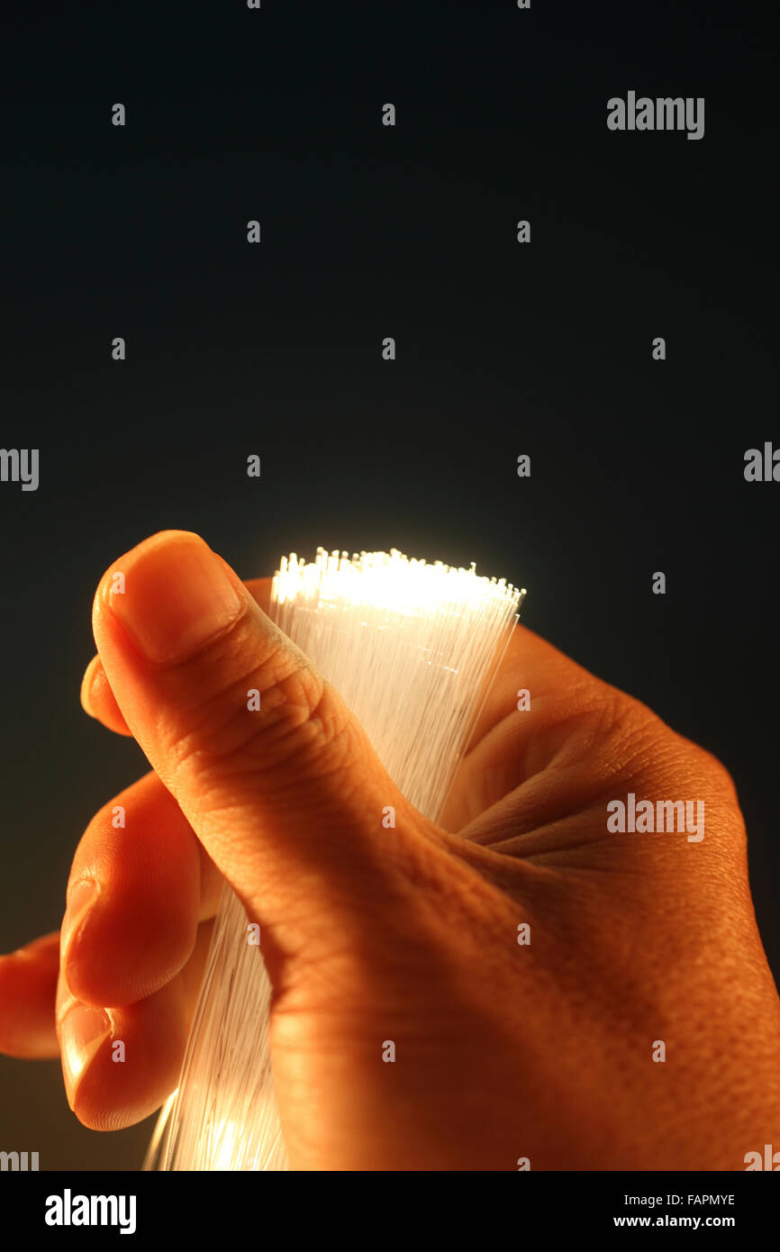 hand holding bundlle of fiber optic Stock Photo - Alamy